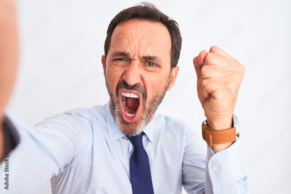 Middle age businessman wearing tie make selfie standing over isolated ...