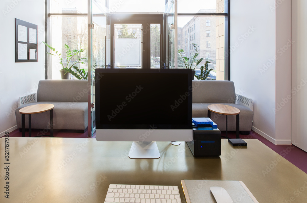 Reception desk with computer and black blank screen Stock Photo | Adobe ...
