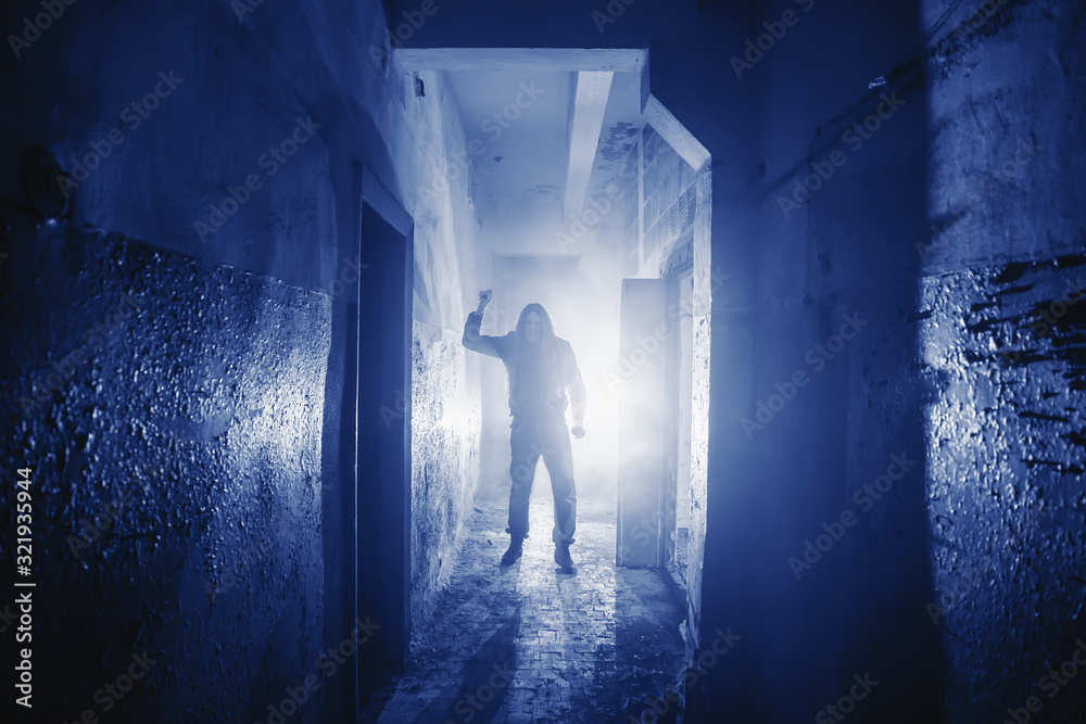 Dangerous Murderer or killer with Knife in hand and light from back in ...