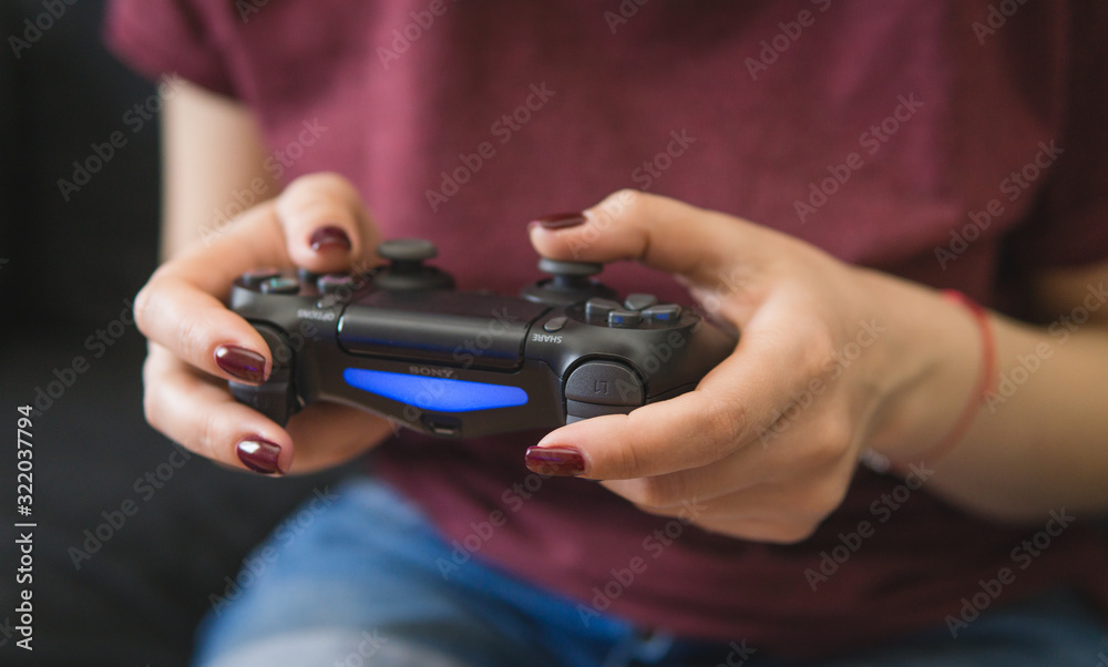 Ukraine, Odessa - July 2, 2019: A girl plays a video game on a ...