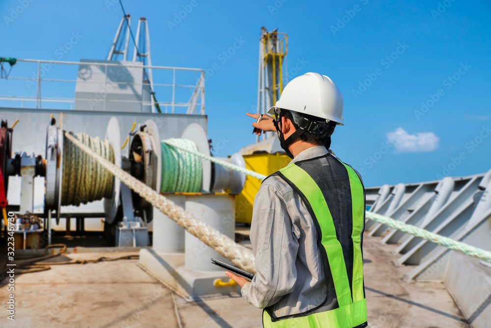 crew worker on ship ipad in hand of Engineering Supervisor, foreman ...