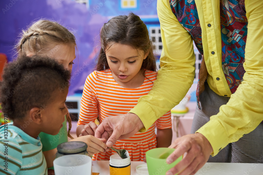 Kids doing a chemical experiment in playroom. Kids having fun at ...