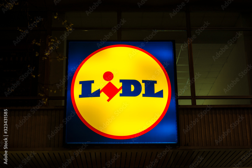 Logo of Lidl supermarkets illuminated at night Stock Photo | Adobe Stock