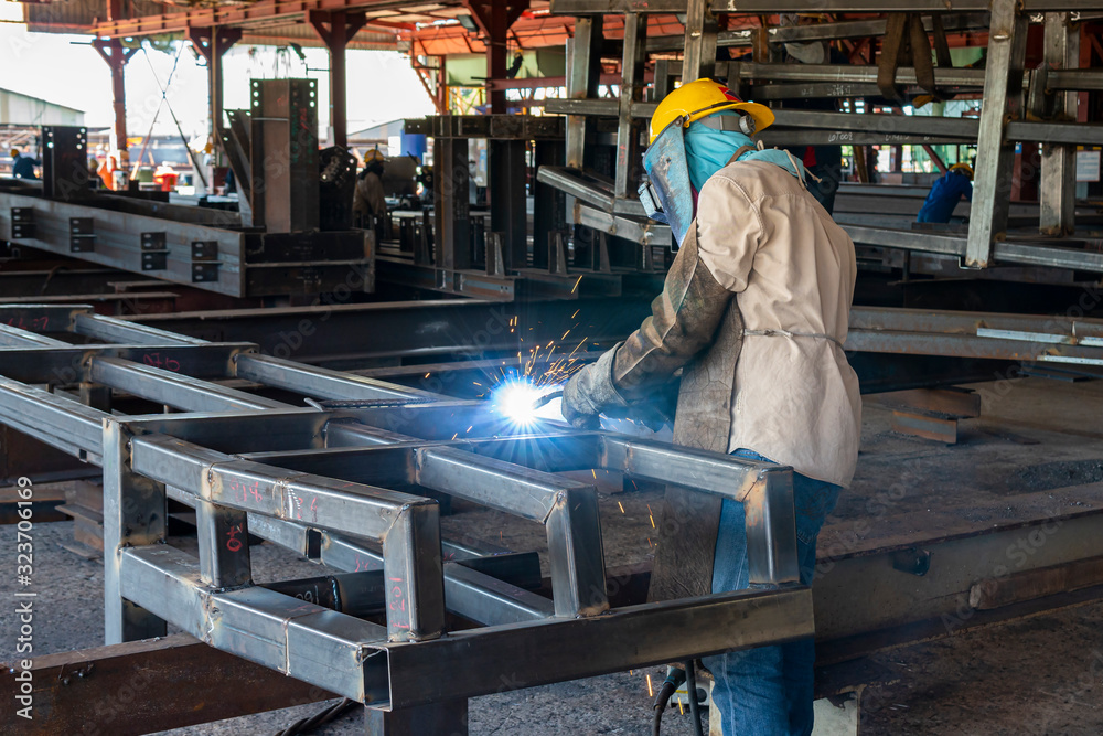 Photo Stock The welder is welding a steel structure work with process ...