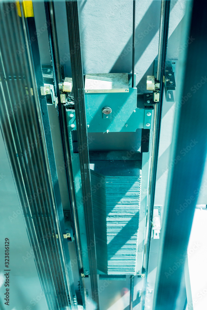 Blurred images see from inside the lift are moving. Structure and ...