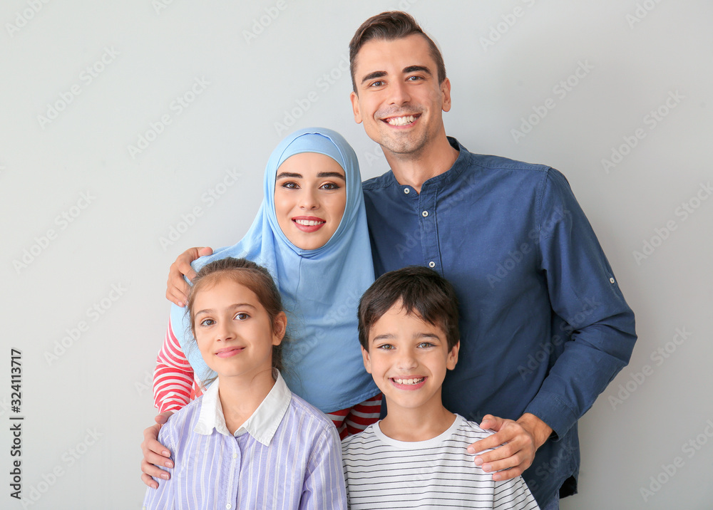 Portrait of Muslim family on light background Stock Photo | Adobe Stock