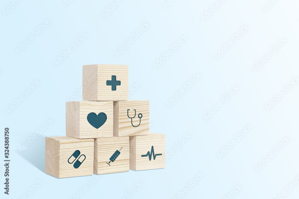 Medical symbols on wooden blocks. Medical and pharmaceutical concept ...