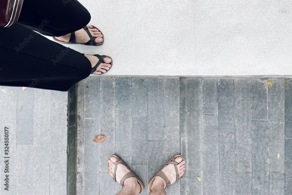 Top view of lower human body parts with legs and foots wearing sandals ...