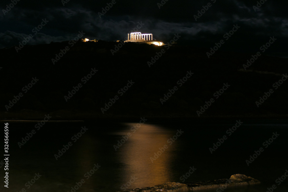 Panoramic night view of the remains of a Greek temple dedicated to ...
