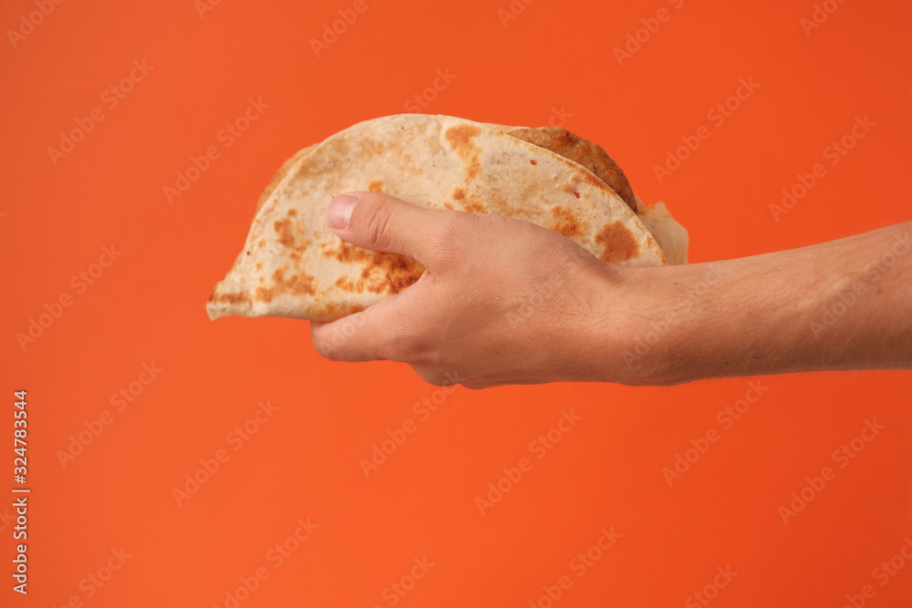 Mexican national food taco or Tatar national food kystyby in hand on an ...