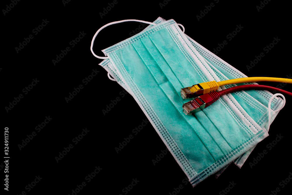 Ethernet lan cable laying on medical face masks for protection from ...