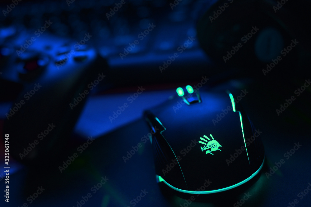 Gamesir g3s video game controller and Bloody p93 gaming mouse on office ...