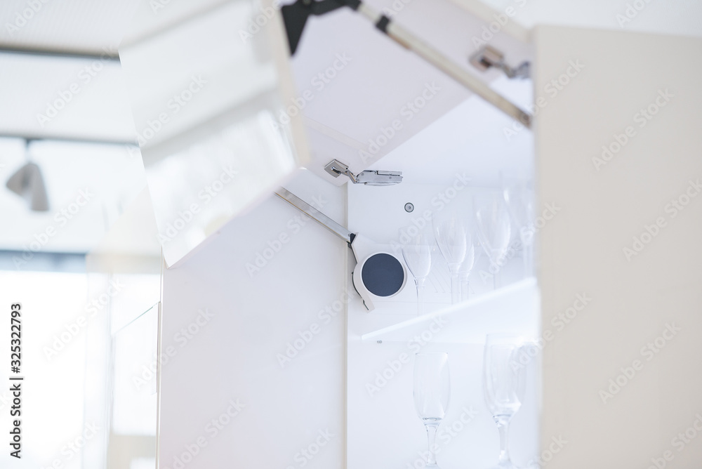 Kitchen cabinet with opened fronts with dish holder shelves inside ...