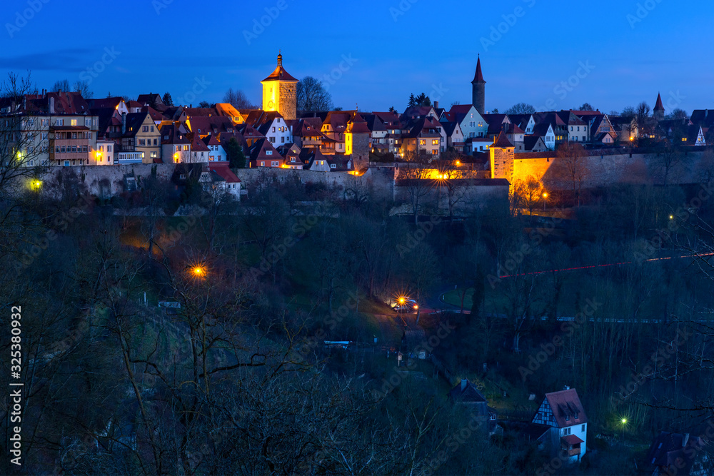 Stock-Foto „Night aerial view of roofs, towers and town wall in ...