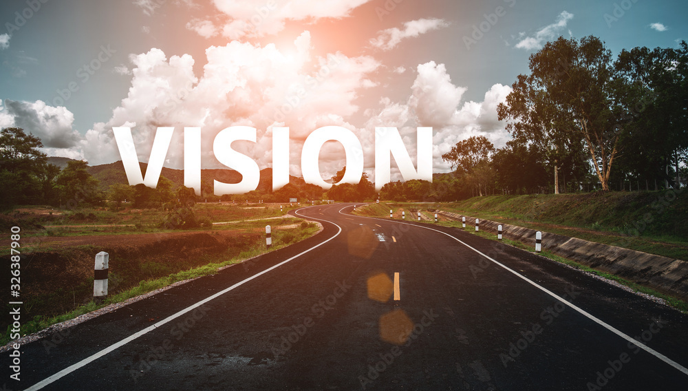 The word vision behind the tree of empty asphalt road at golden sunset ...