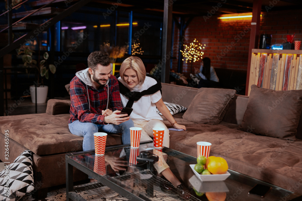 On the modern work office studio one good looking guy and pretty lady ...