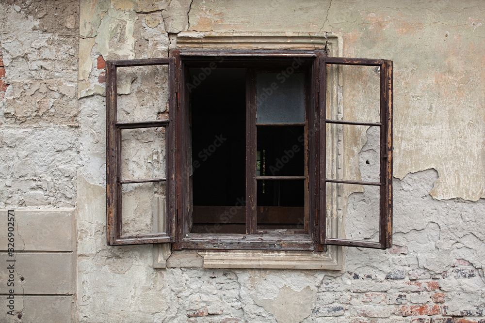 Old wooden window, open, no glass, just frame on an old abandoned ...