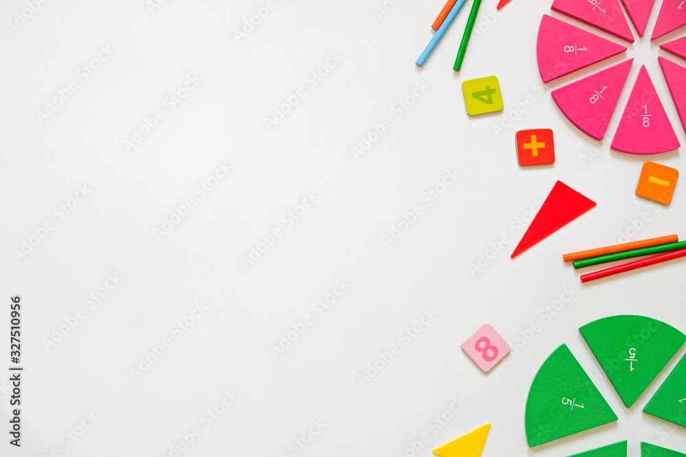 Mathematics background - fractions on white table, close up. Dividing ...