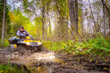 Man With ATV Stuck In Mud Free Stock Photo - Public Domain Pictures