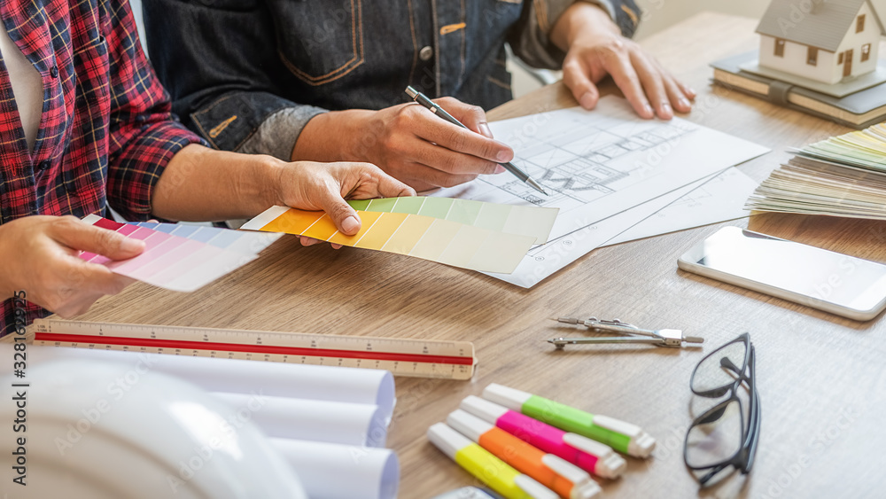 Interior designer and Architect choosing color in color swatch samples ...