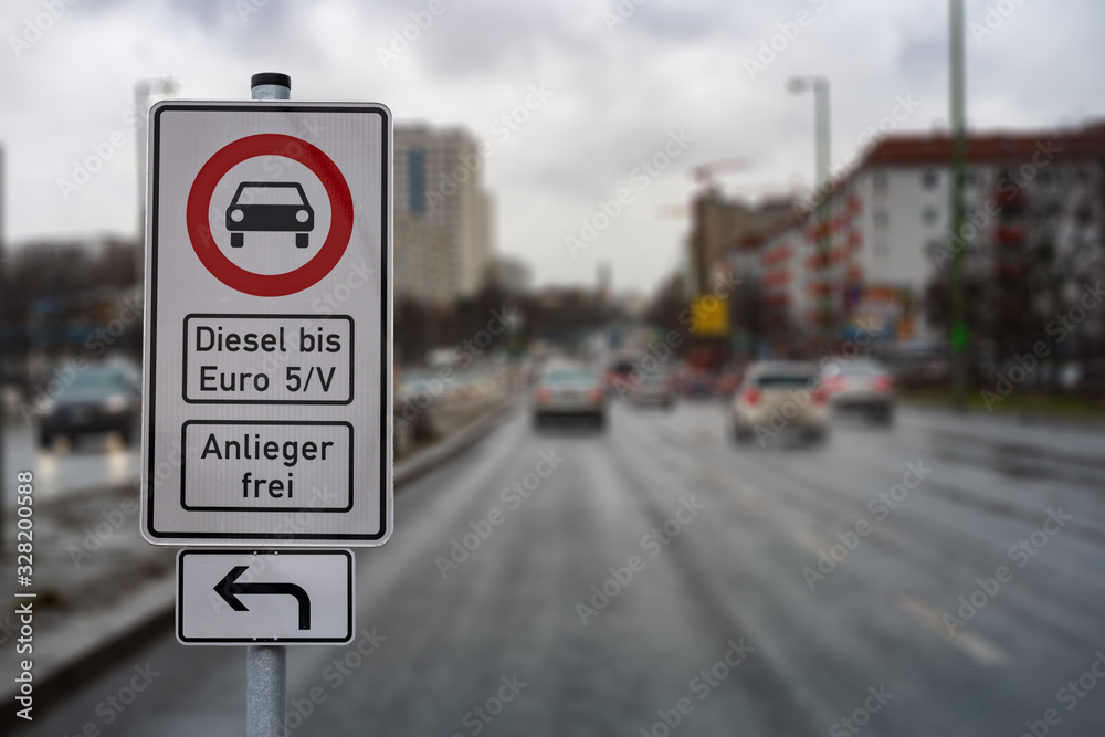 german street sign diesel driving ban in the downtown with a blurred ...