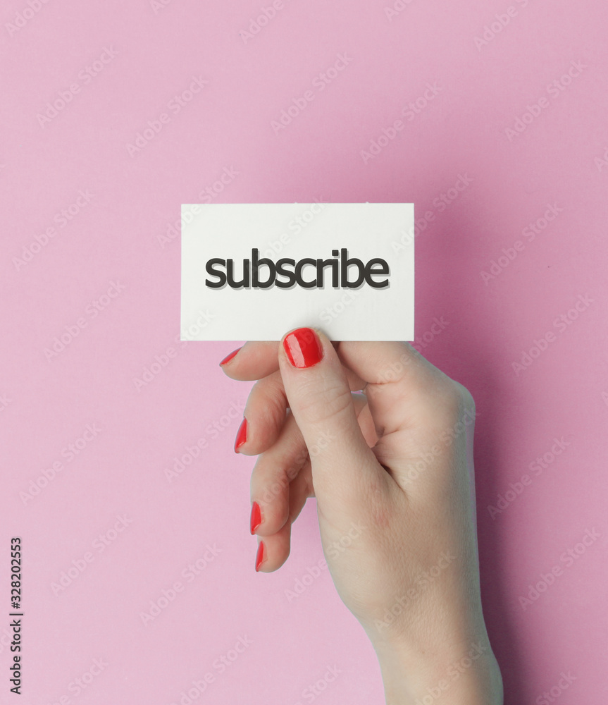 Hand holding a paper note with subscribe text Stock Photo | Adobe Stock