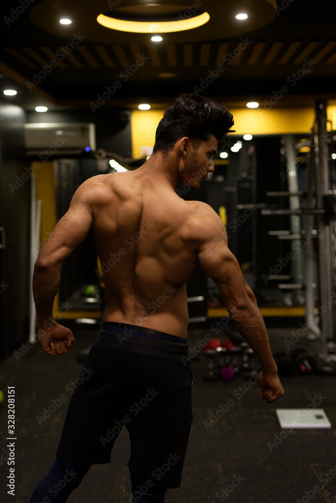 An young and handsome Indian Bengali brunette man with muscular body ...