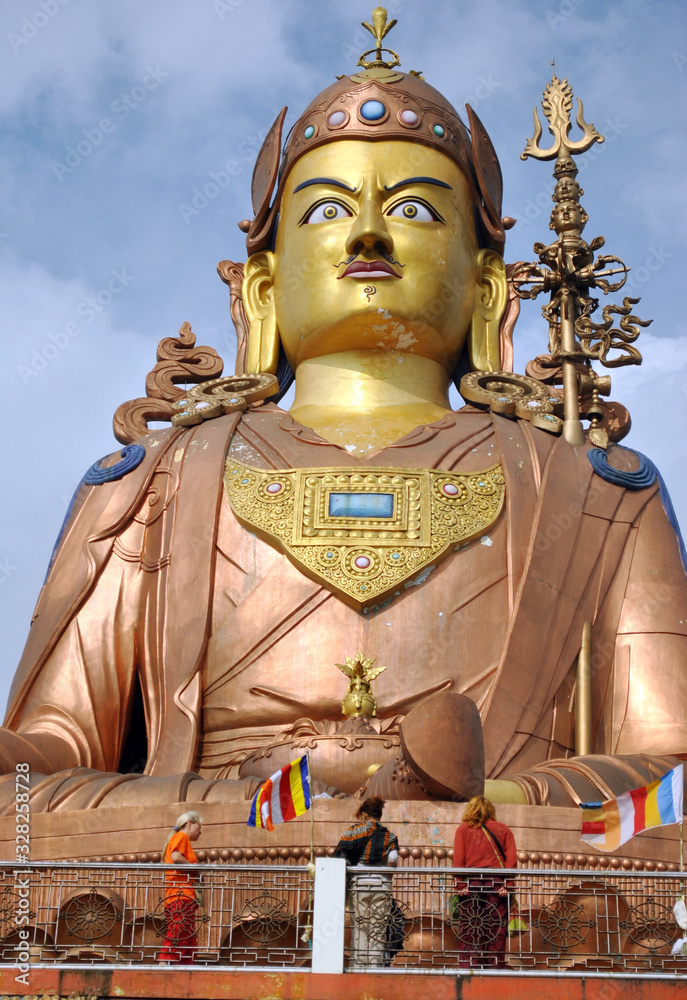 Tourist offering prayers at giant statue of Guru Padmasambhava at ...