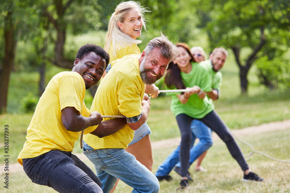 Two teams competing in tug-of-war Stock Photo | Adobe Stock