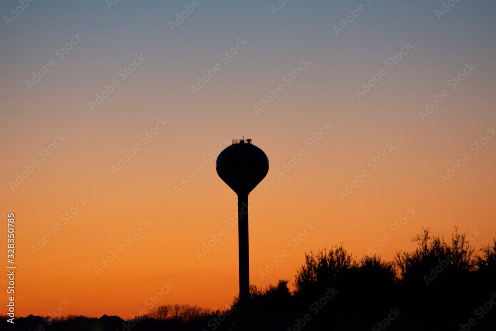 silhouette of a water tower at sunset Stock Photo | Adobe Stock
