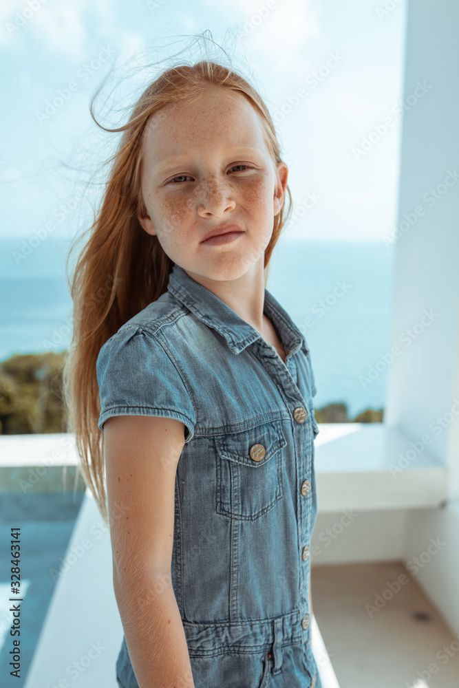 Little girl with red hair shows different emotions. Sadness, joy and ...