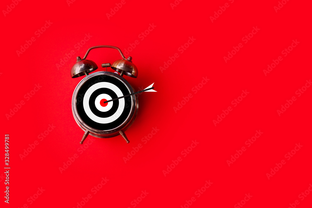 target time, goal sign on clock face over red background with copy ...