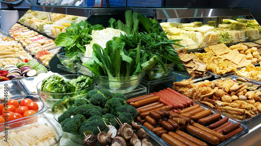 Showcases with a beautiful layout of Chinese food. Food court in the ...