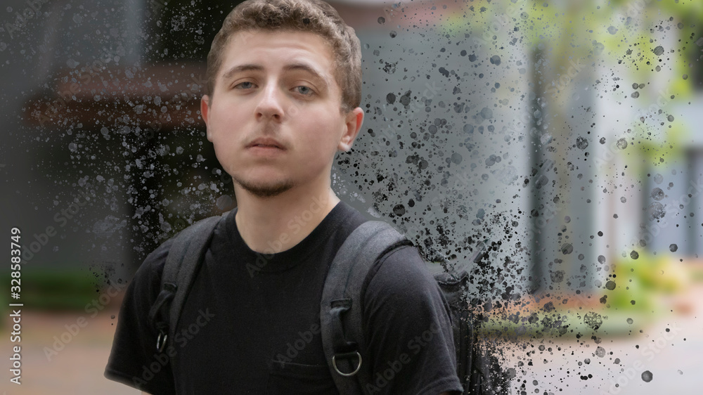 A young Caucasian man with blue eyes stares straight into the camera ...