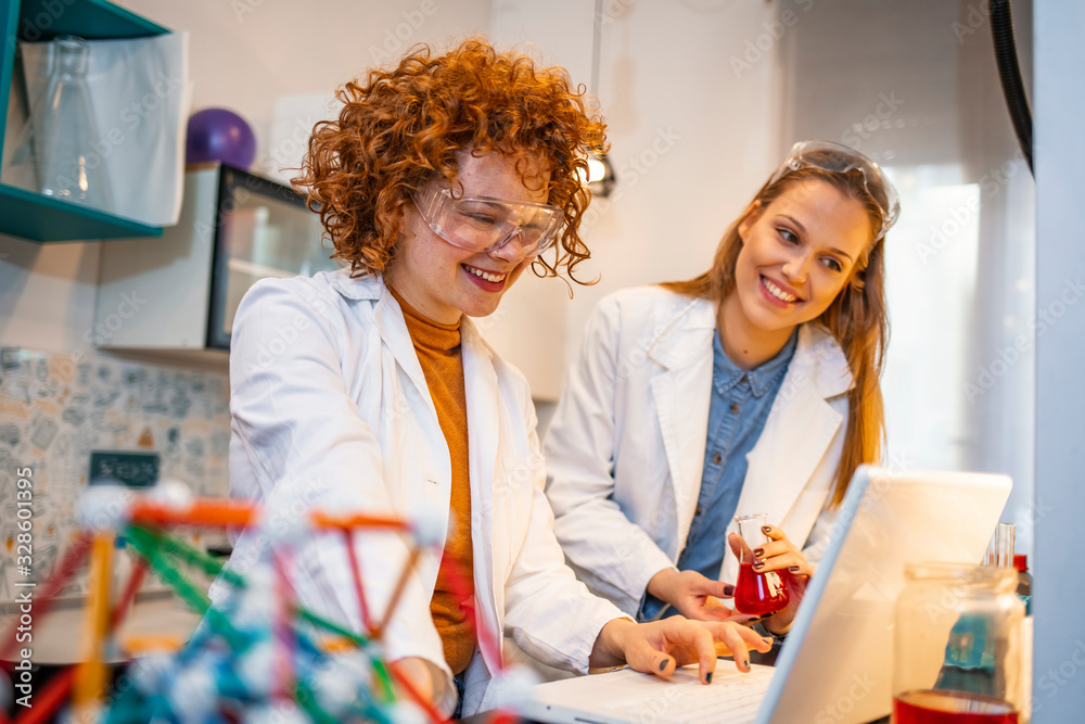 Female Scientists in a laboratory. Female medical researchers. Real ...
