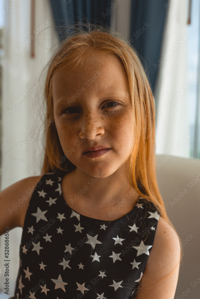 Little girl with red hair shows different emotions. Sadness, joy and ...