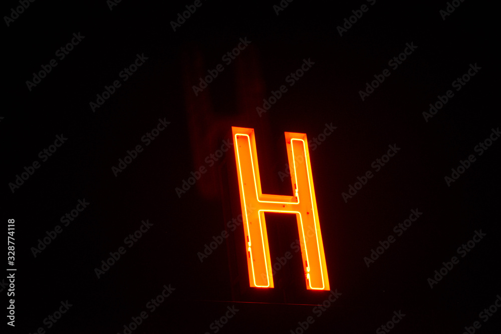 Stock-Foto „Neon red,orange letter H with a faint upside down ...