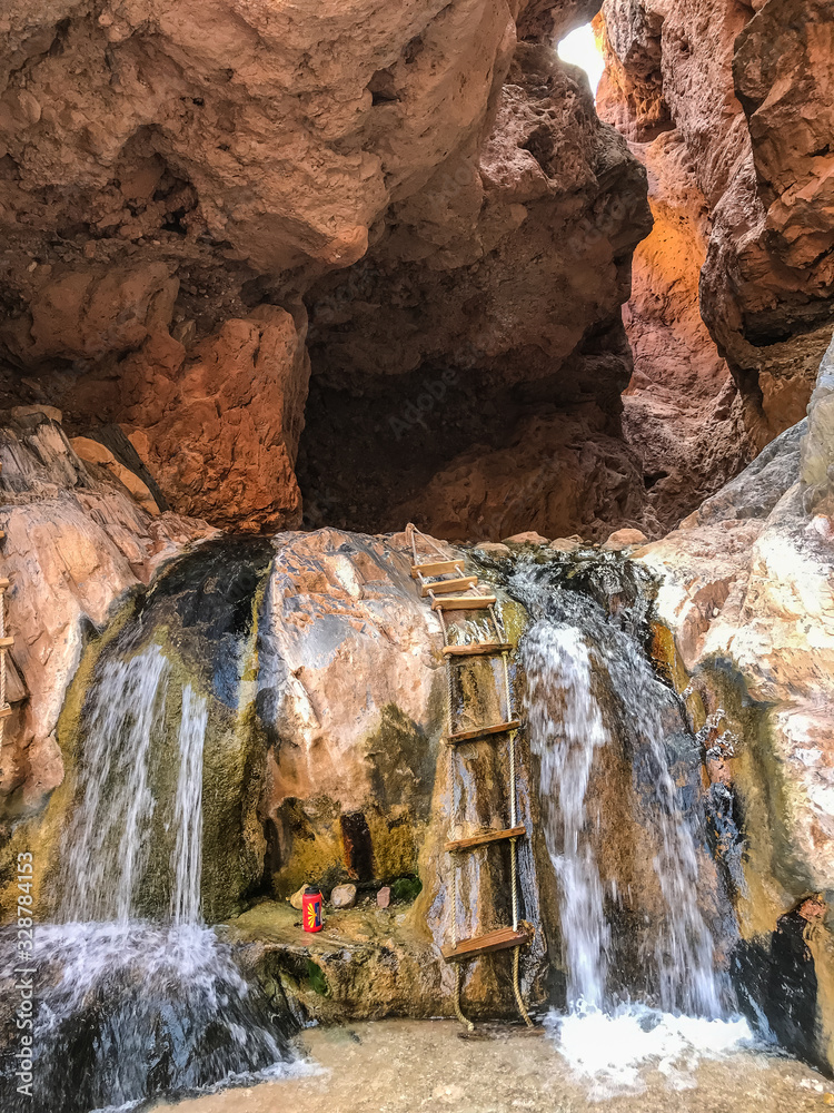 Foto de Stock Travertine Grotto waterfalls with wood plank step and ...