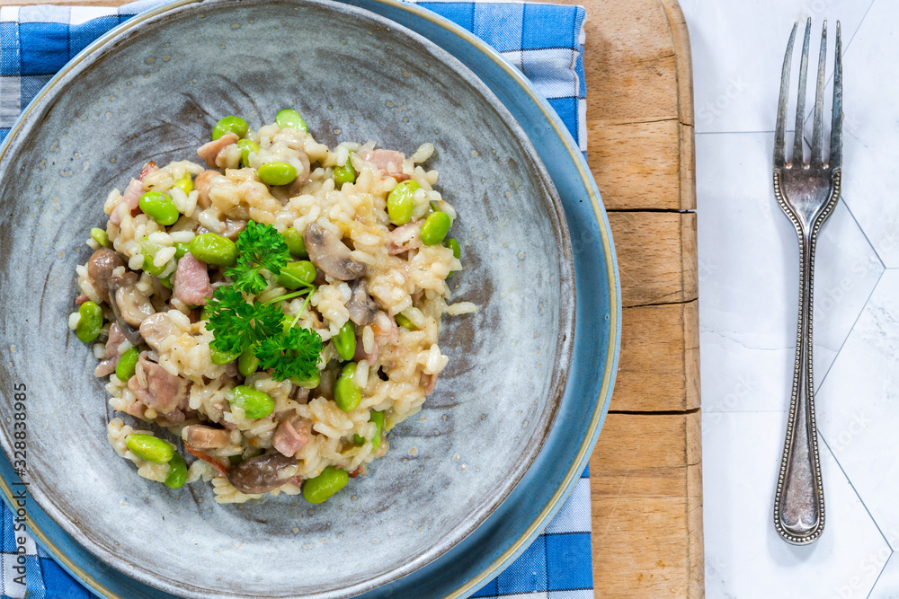 Bacon and mushroom risotto with edamame beans - overhead view Stock ...