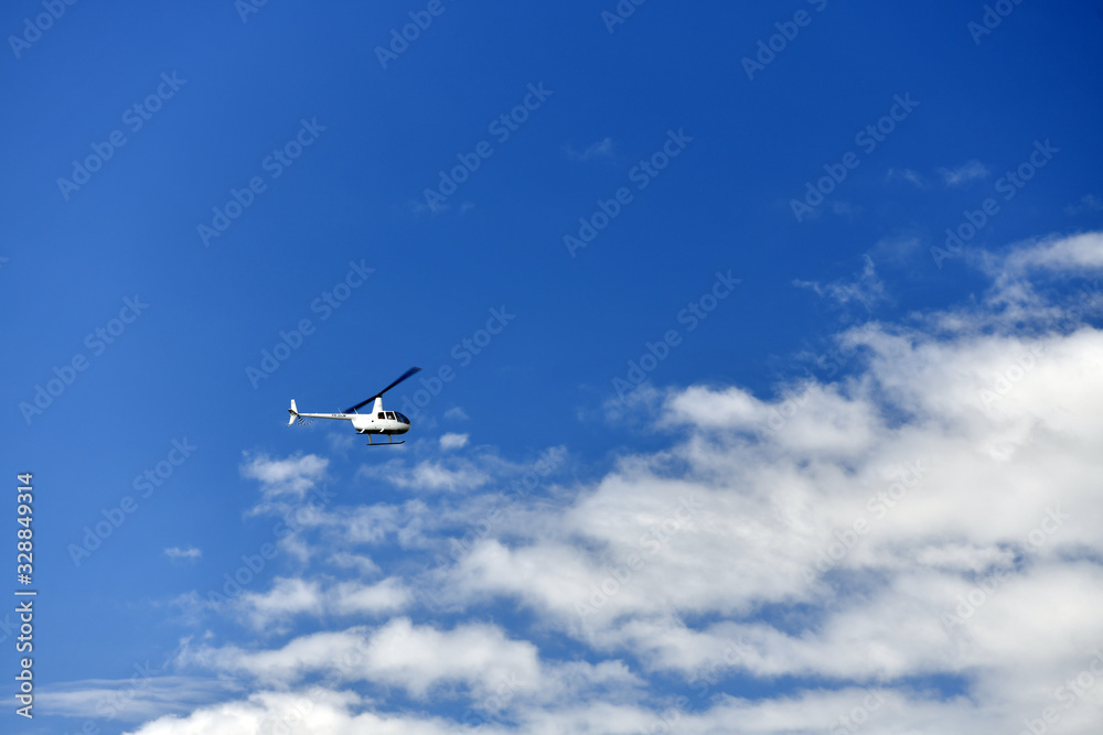 big tourist helicopter against the blue sky in the area of the Christ ...