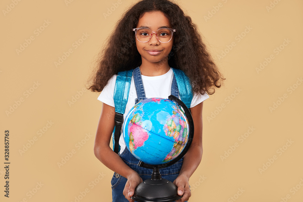 African kid with globe during lesson Stock Photo | Adobe Stock