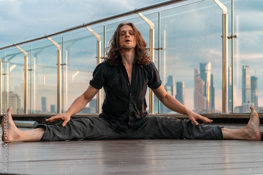 Athletic Sporty Man Doing Straddle Splits Outdoors On Urban Background ...