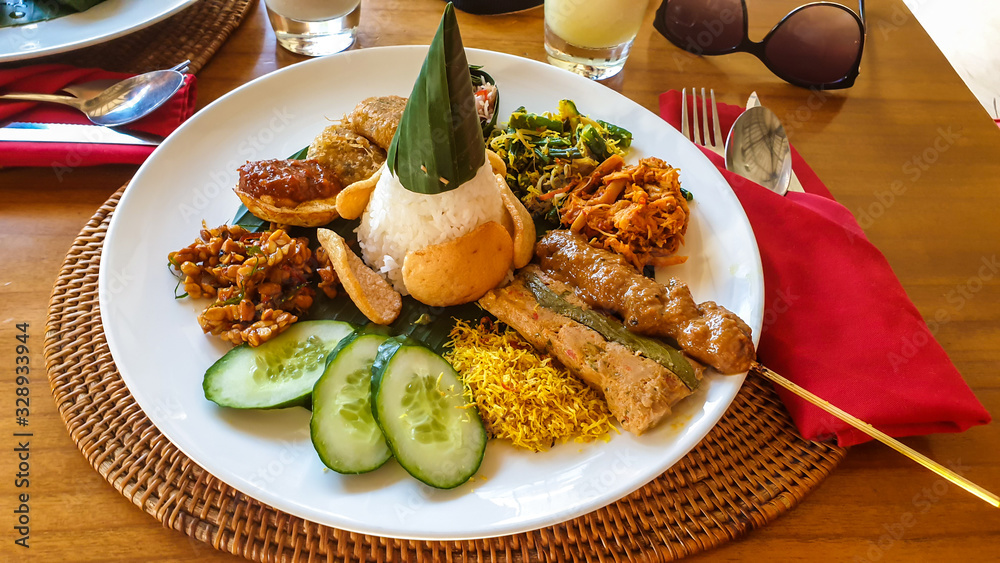 Traditional Indonesian meal consisting of different varieties of local ...