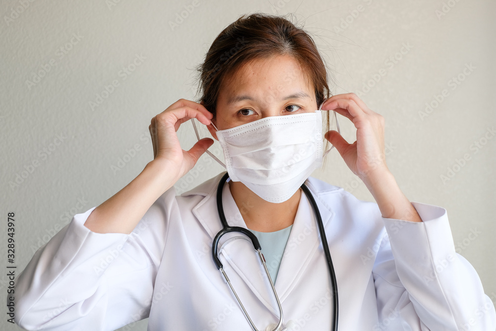 lady or woman doctor wear the medical mask to protect infection from ...