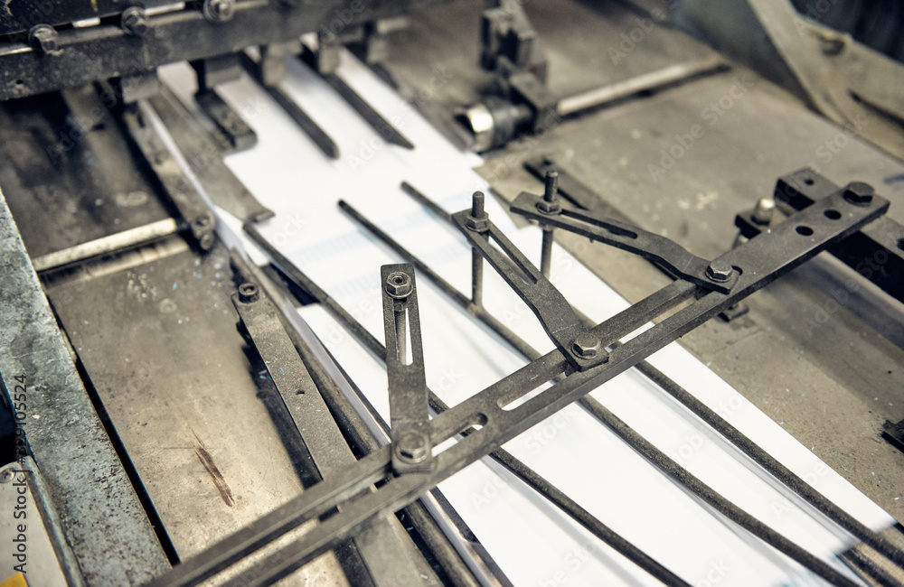 A industrial commercial envelope making machine, making paper envelopes ...