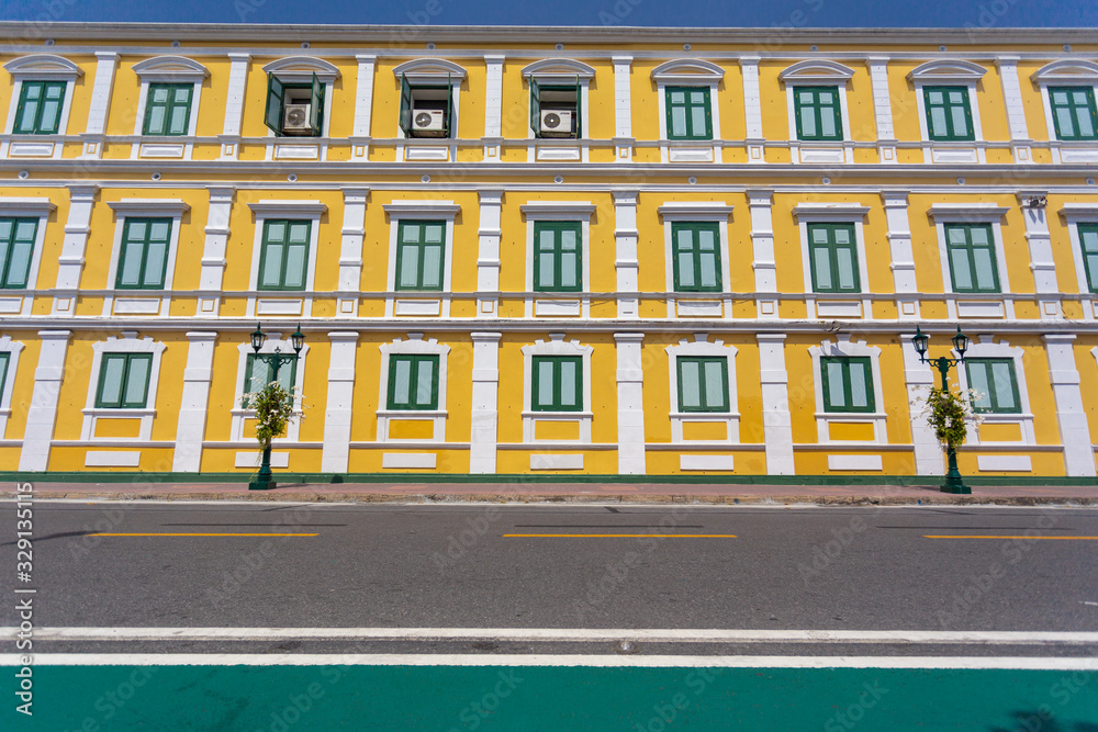 Beautiful windows and yellow walls of Thai Ministry of Defence building ...