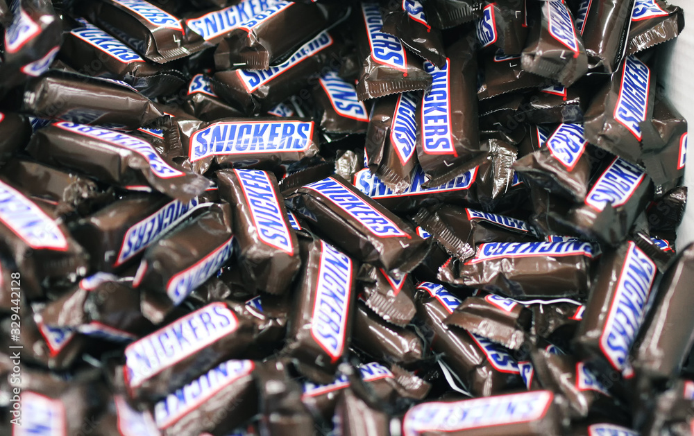 Kiev, Ukraine - January 22, 2019. Pile of candies "Snickers". Snickers ...