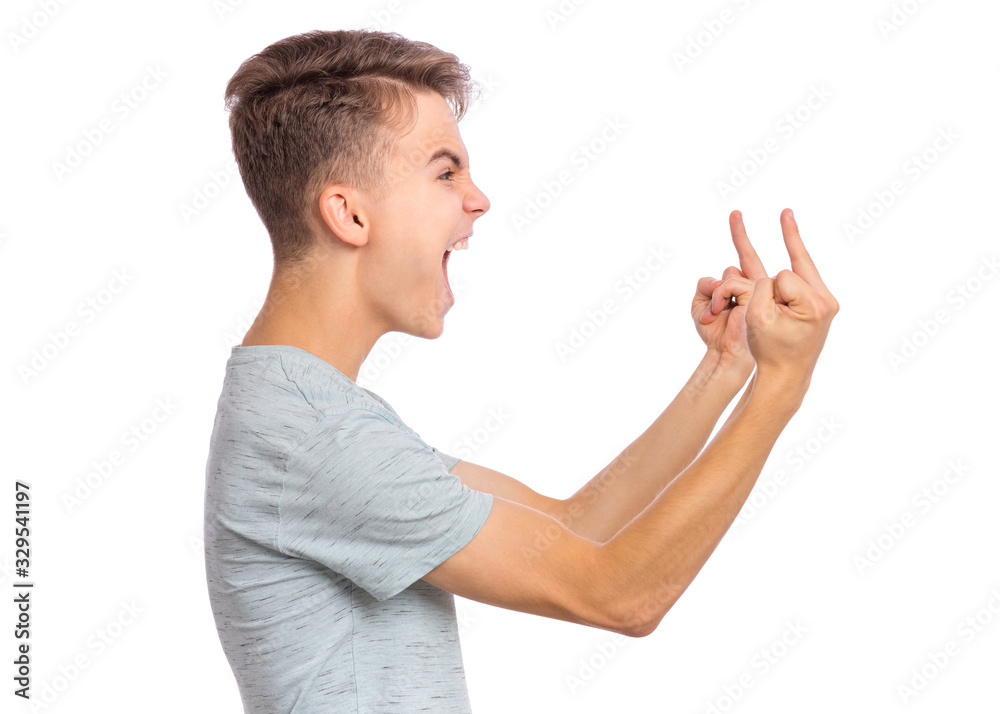 Angry teen boy showing middle finger - side view, isolated on white ...