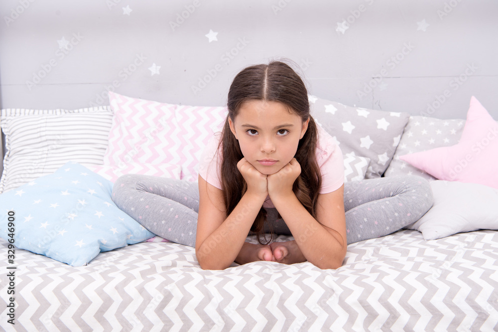 Why so sad. Sad girl sit in bed. Little child with sad look. Bedtime ...
