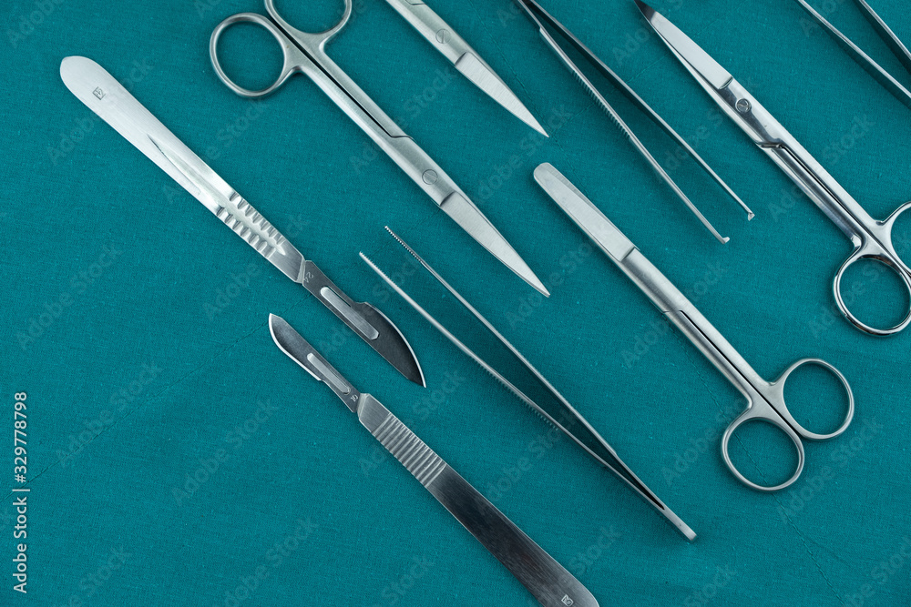 Basic surgical instrument scalpel forceps tweezers scissors spread on ...